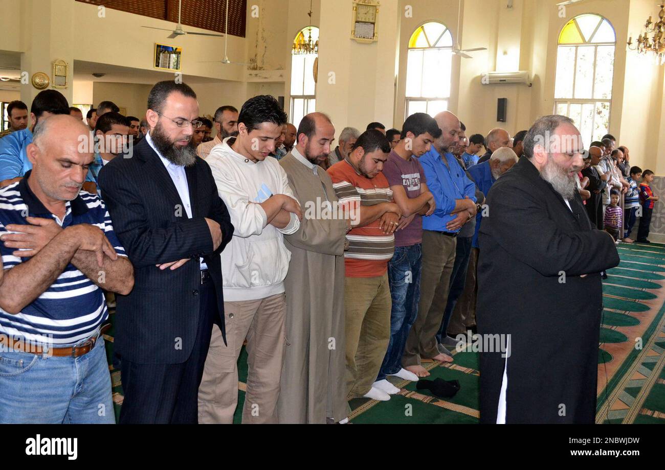Radical cleric Omar Bakri Mohammed, right, leads Friday prayers for al ...