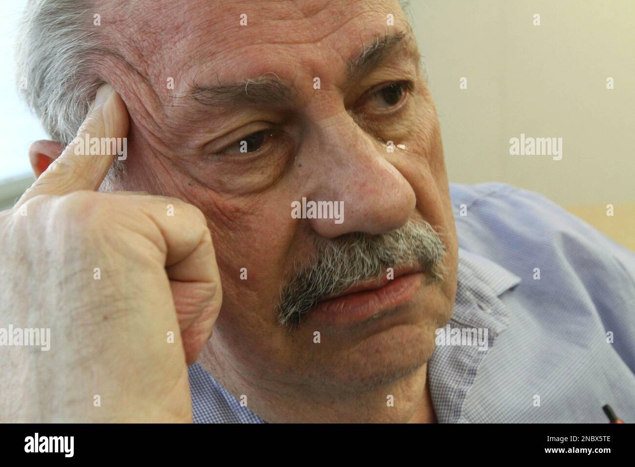 In this April 21, 2011 photo, Claus Hirsch reacts as he is interviewed ...