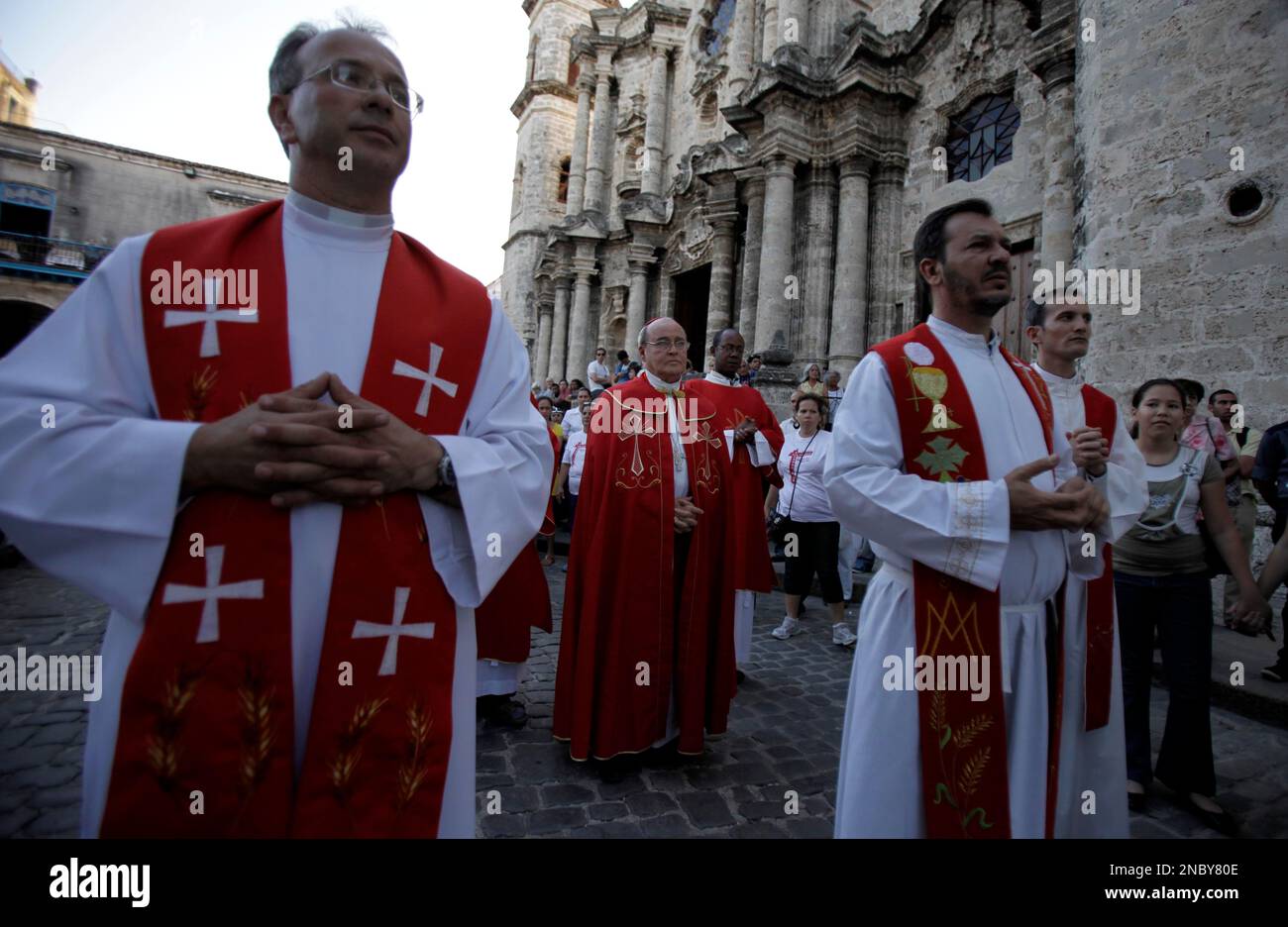 Cuba's Cardinal Jaime Ortega, center, attends a Holy Week procession on ...