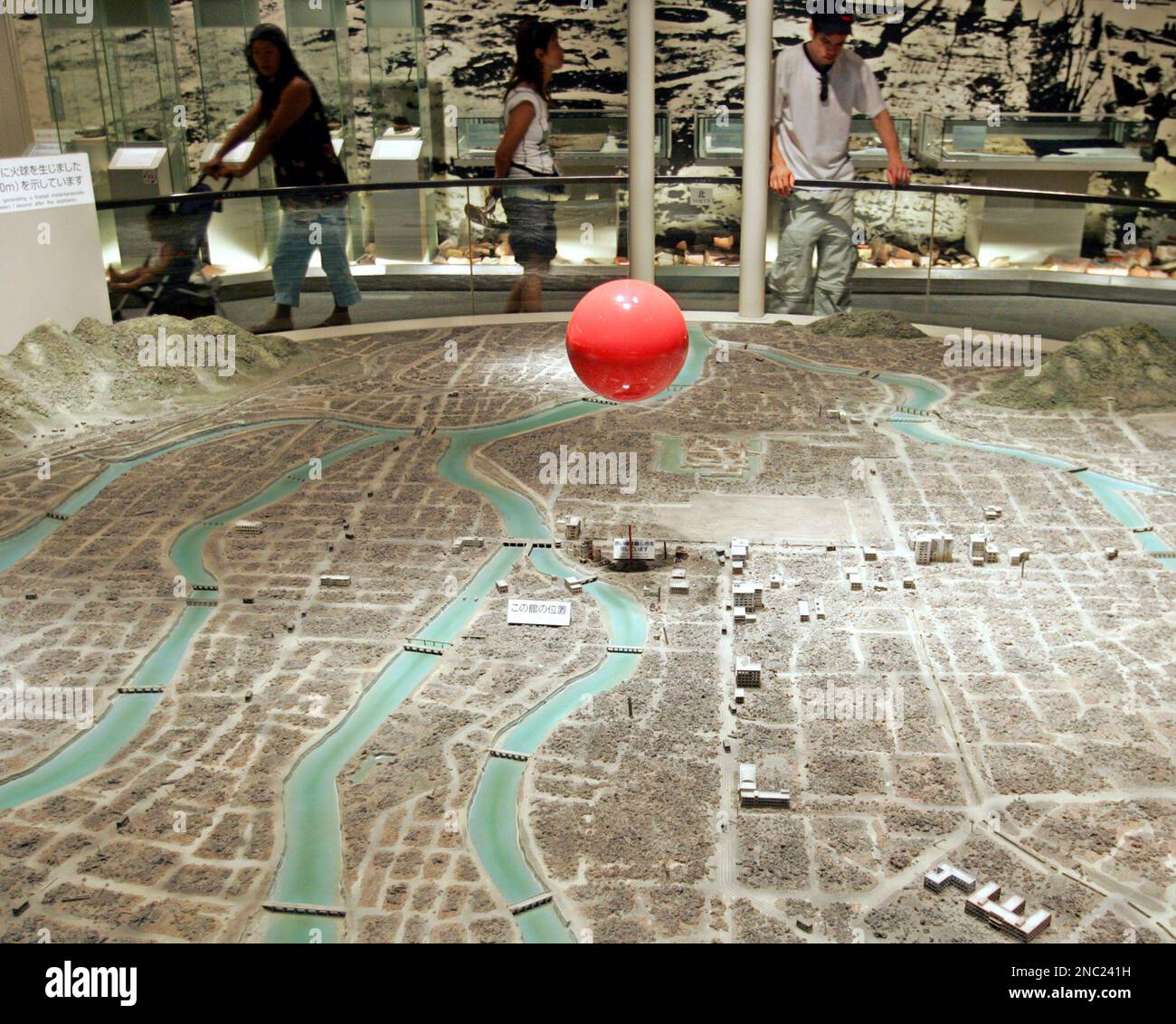 FILE- This June 9, 2005 file photo shows visitors as they study a model ...