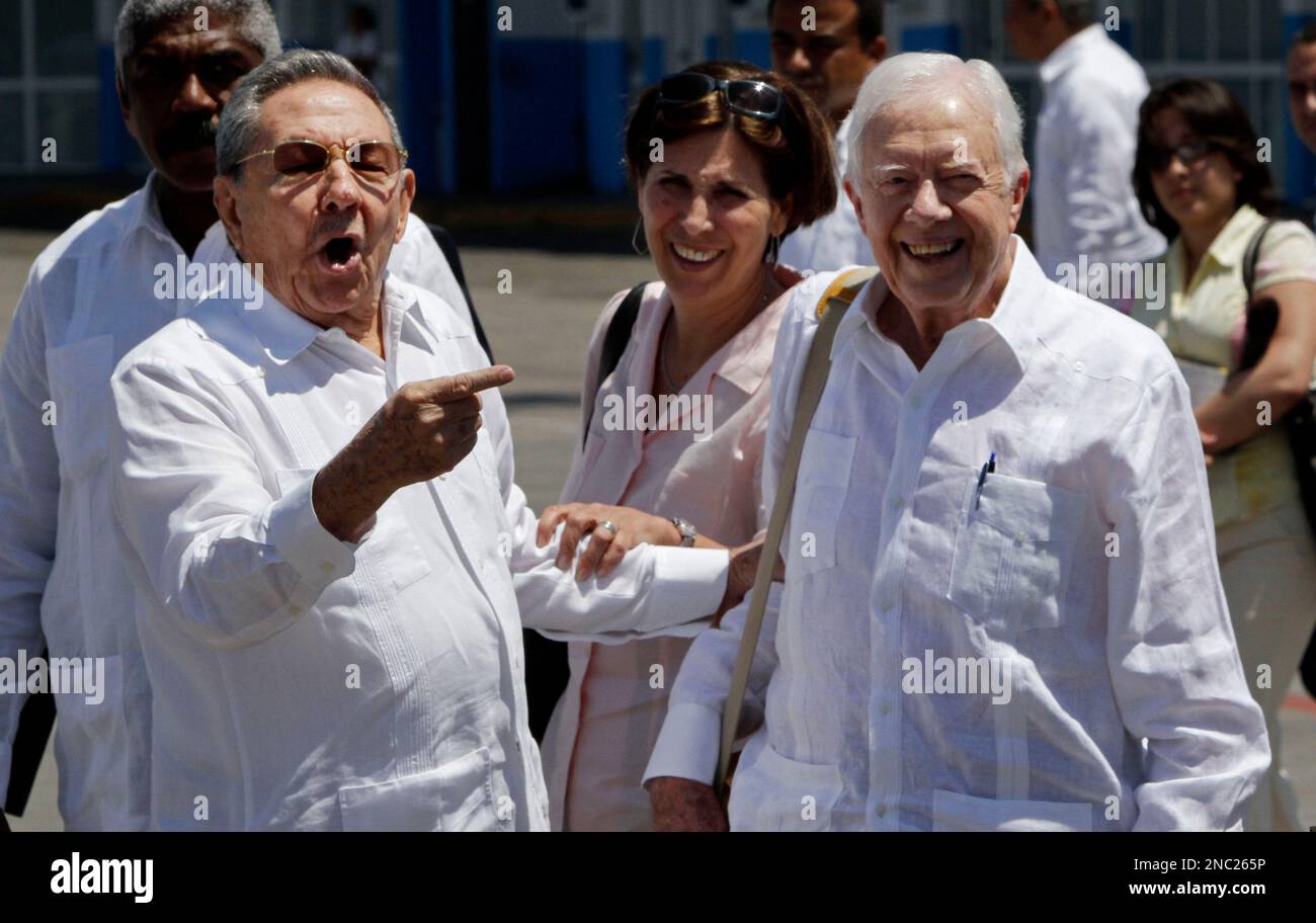 Cuba's President Raul Castro, left, gestures next to former President ...