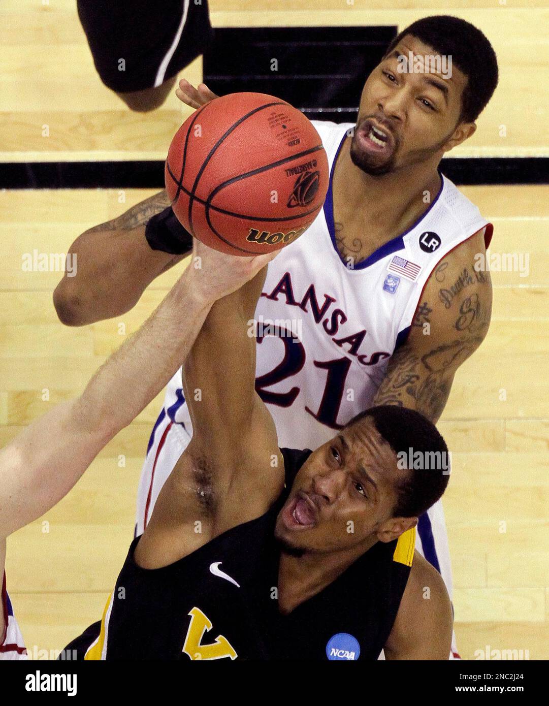 Virginia Commonwealth's Bradford Burgess, bottom, shoots as Brady ...