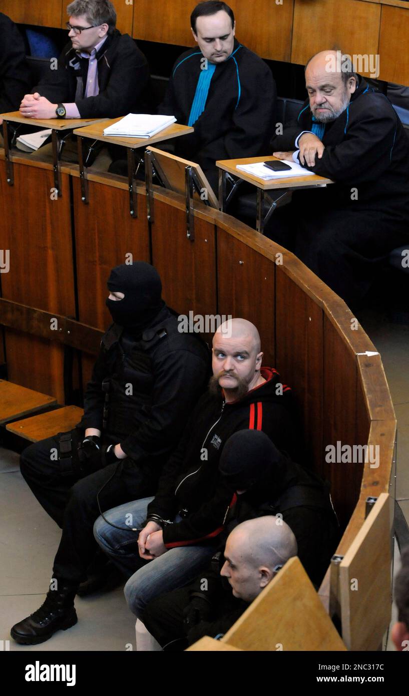 Suspects Zsolt Peto, center, and Istvan Csontos, bottom, two of the ...