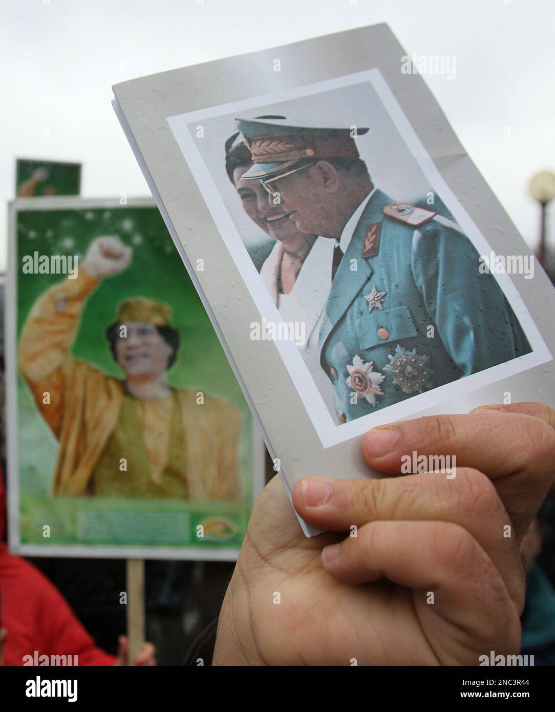 A protester holds up picture of late Yugoslav Communist leader Josip ...