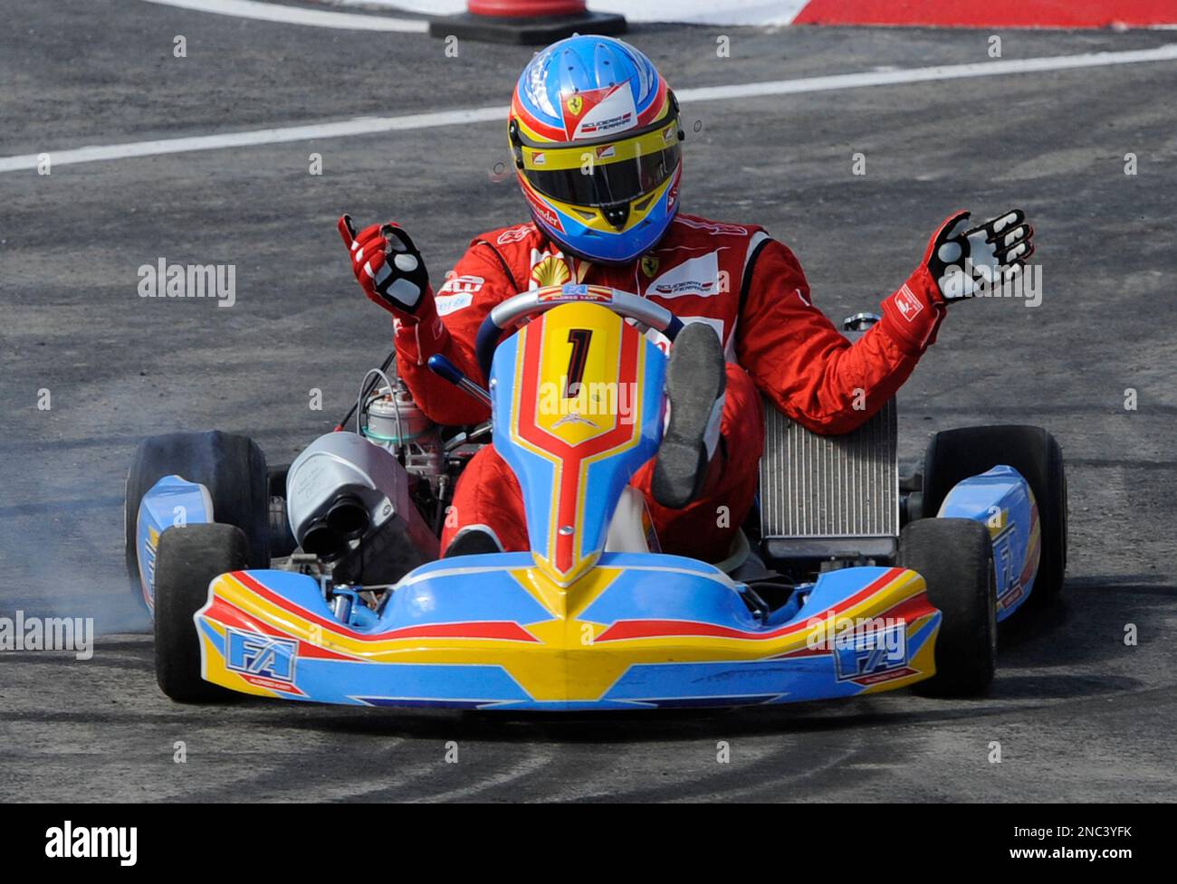 Ferrari F1 driver Fernando Alonso reacts during a exhibition lap during ...