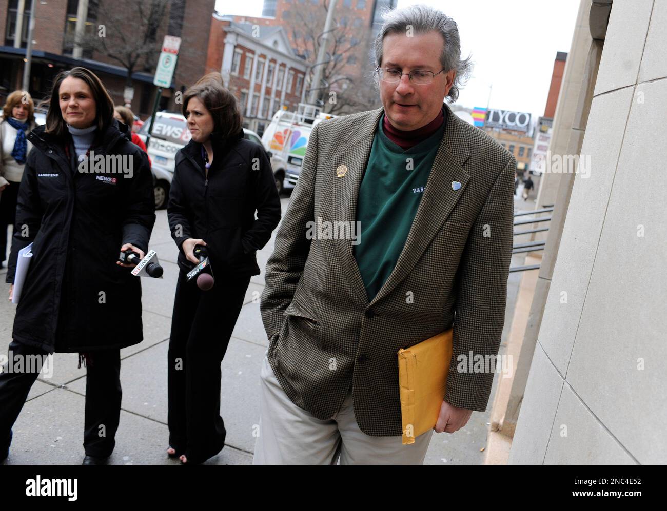 Dr. William Petit Jr., right, walks back to at Superior Court after a ...