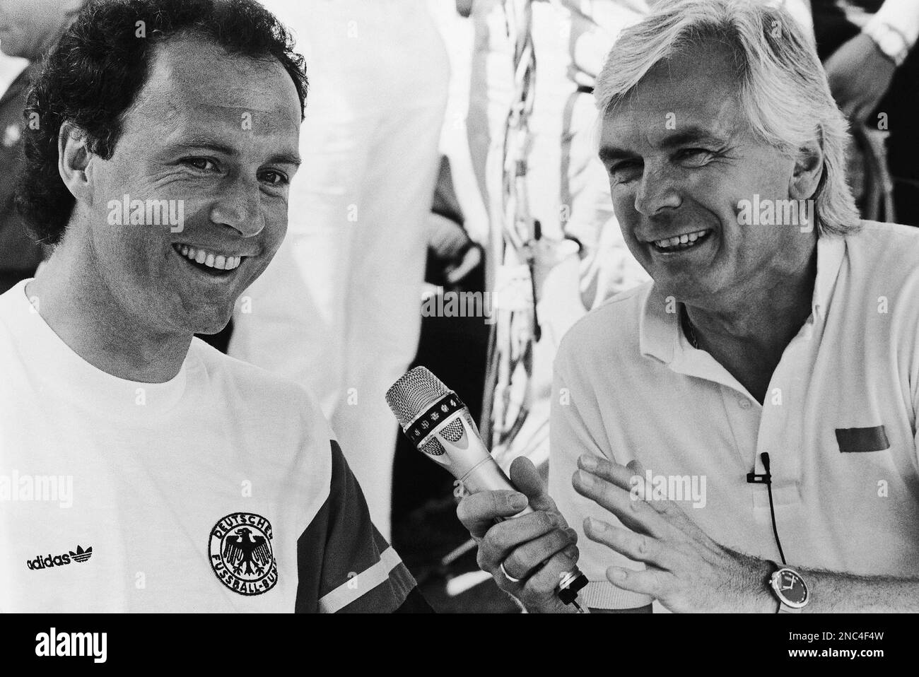 West German soccer team manager Franz Beckenbauer, left, is all smiles ...