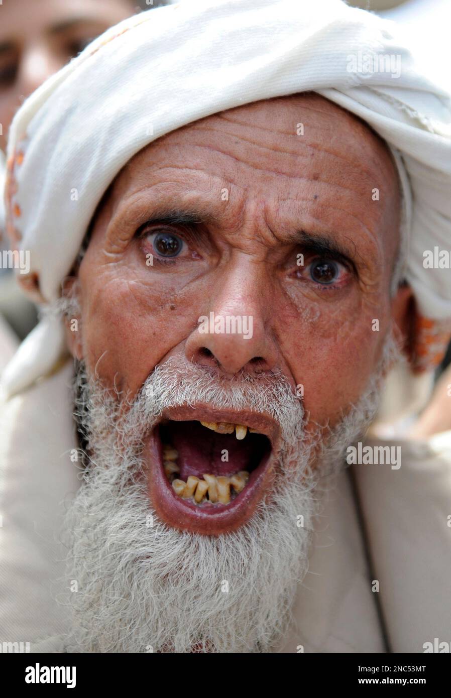 A supporter of Yemeni President Ali Abdullah Saleh shouts slogans during a rally to support ...