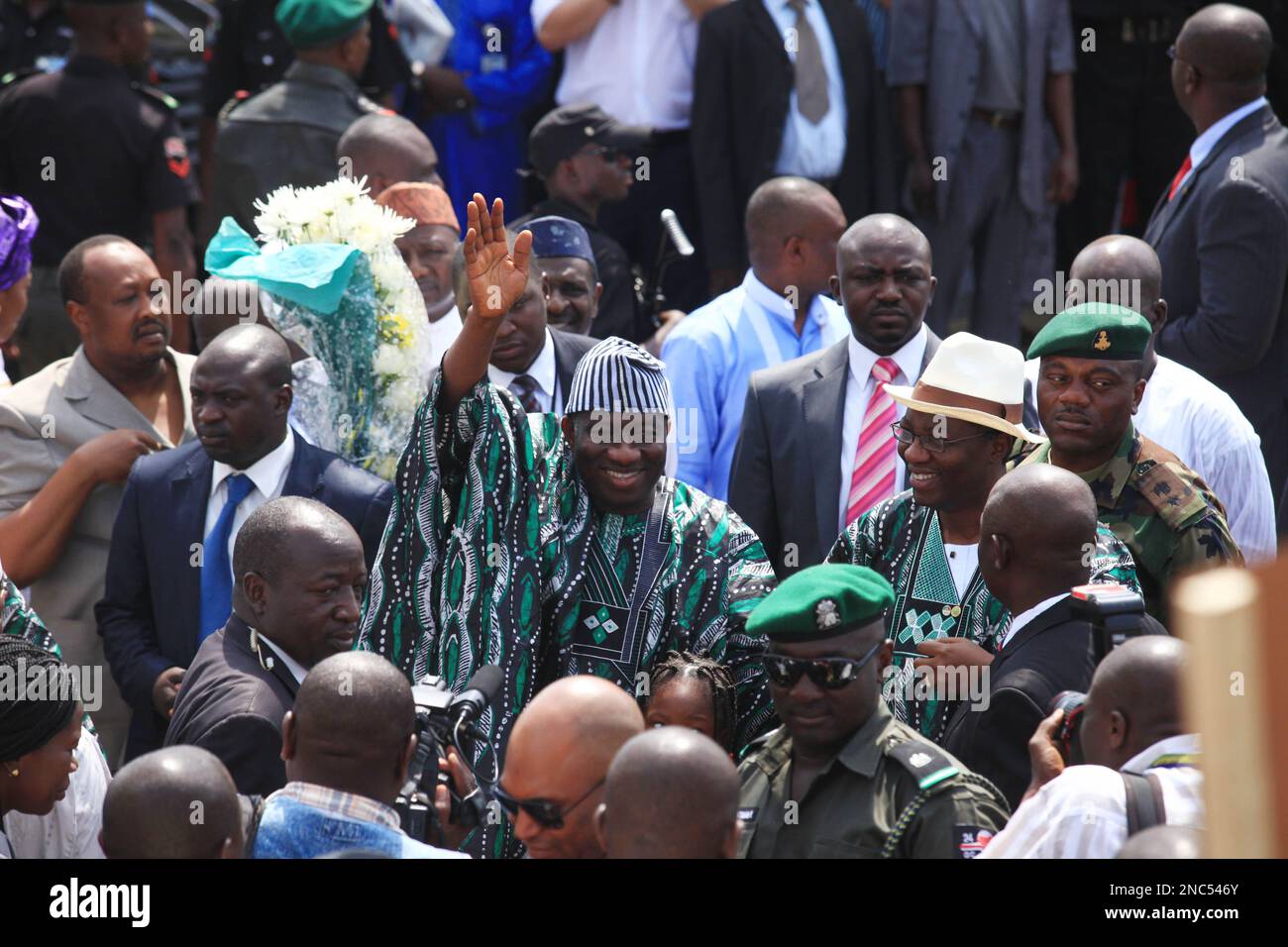 Nigeria President, Goodluck Jonathan, centre, waves to the crowd as he ...
