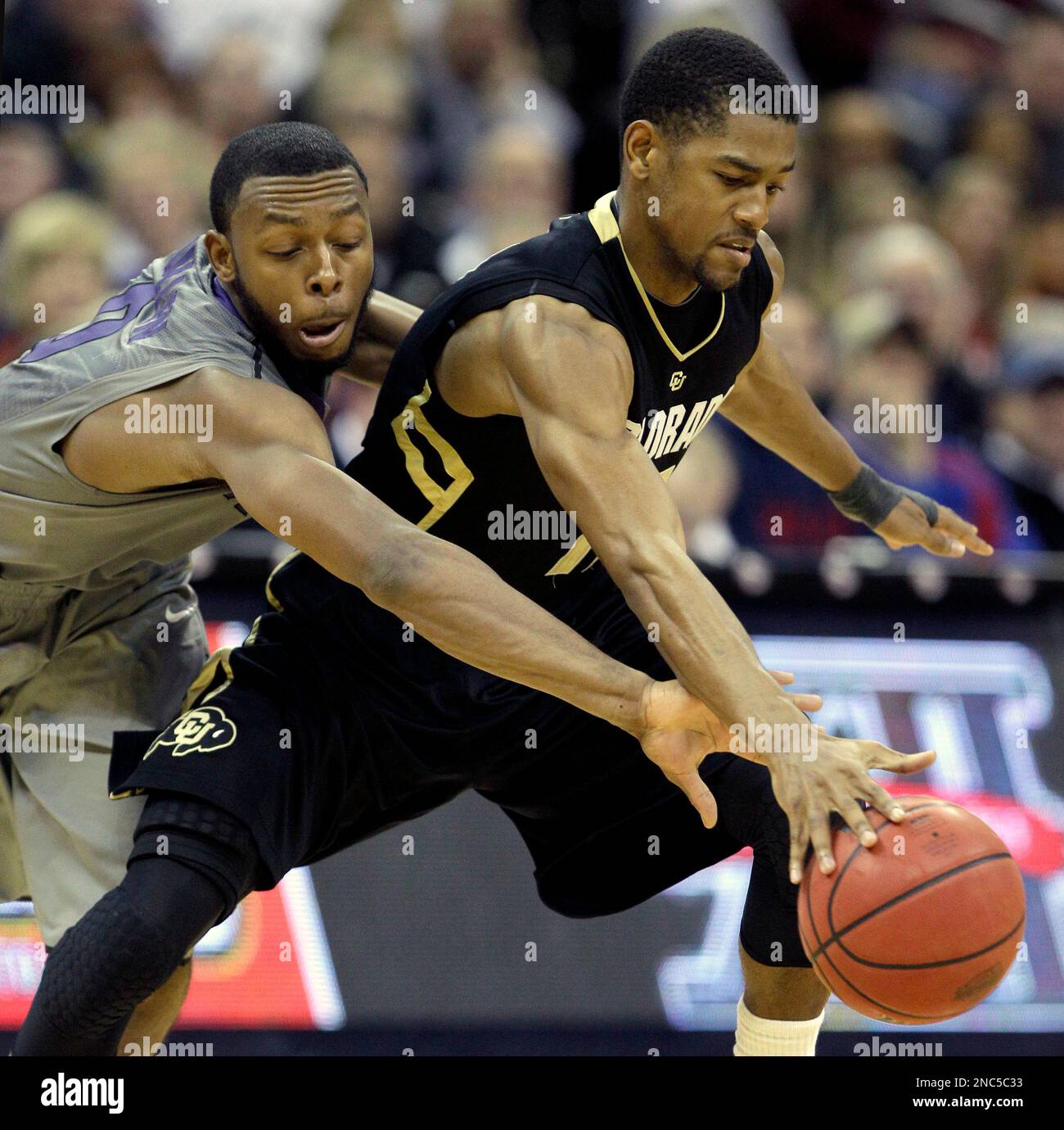 Kansas State guard Jacob Pullen, left, attempts to steal the ball from ...