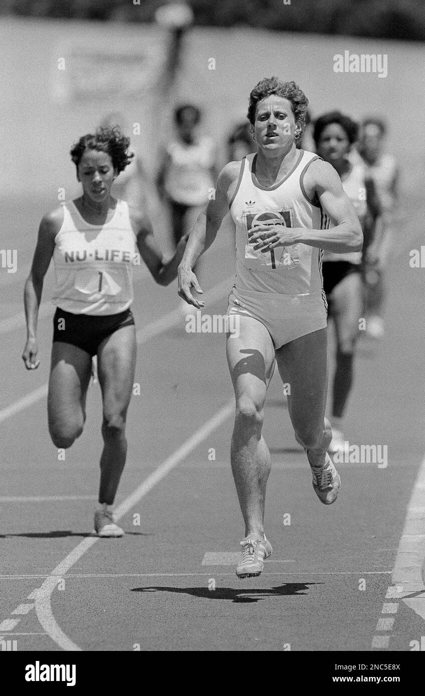Czechoslovakia's Jarmila Kratochvilova, right, crosses the finish line ...