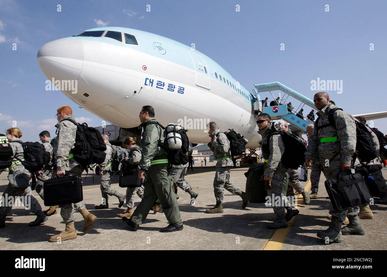 U.S. soldiers arrive from Kadena air base on Okinawa of Japan, by a ...