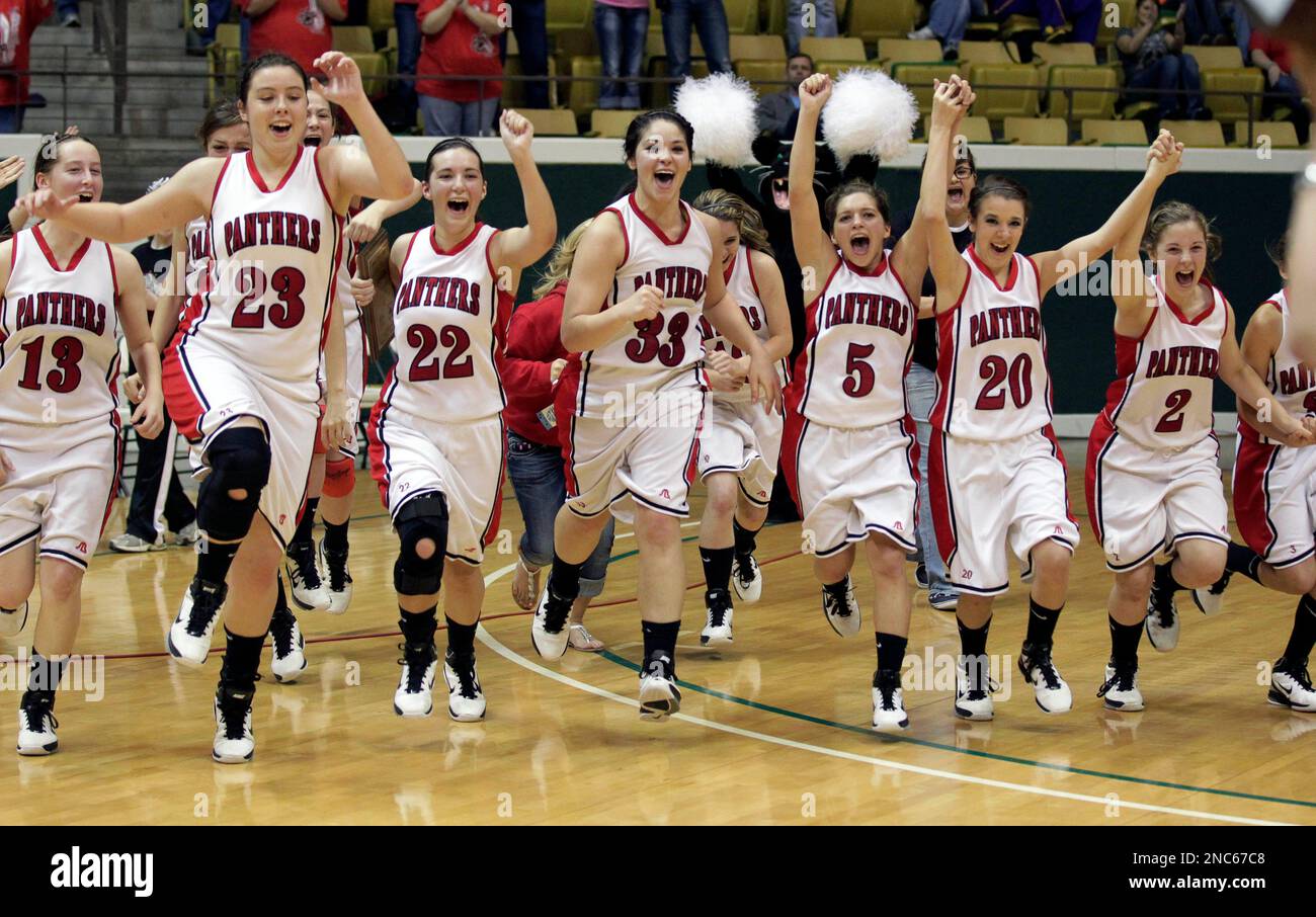 Starks High School players race for the championship trophy to ...