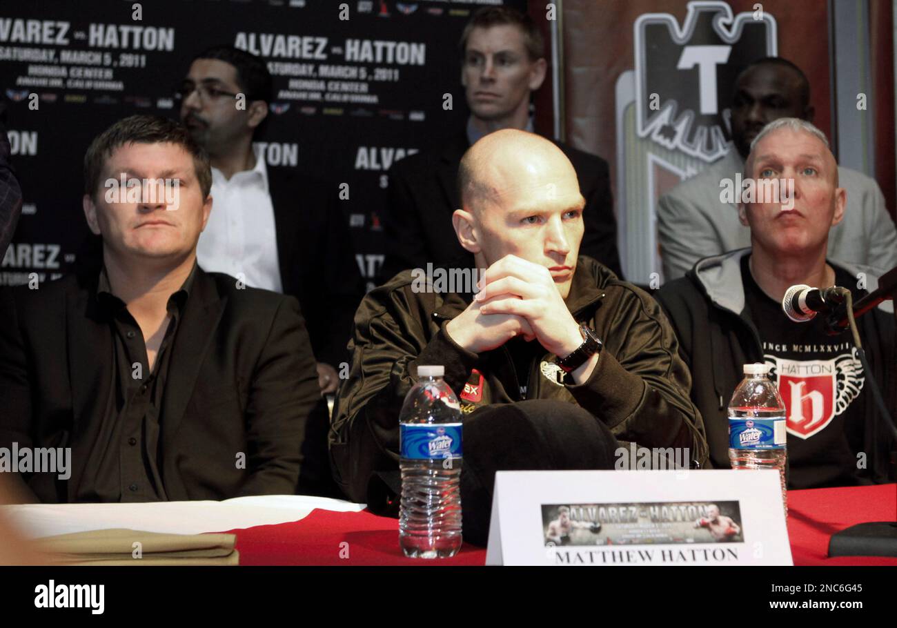 Matthew "Magic" Hatton of Great Britain, center, his brother Ricky hatton, left, and trainer Bob ...