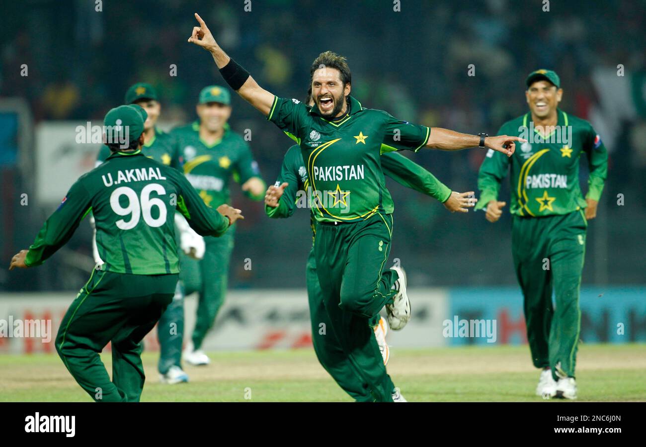 Pakistan captain Shahid Afridi, right, celebrates the wicket of Canadas ...