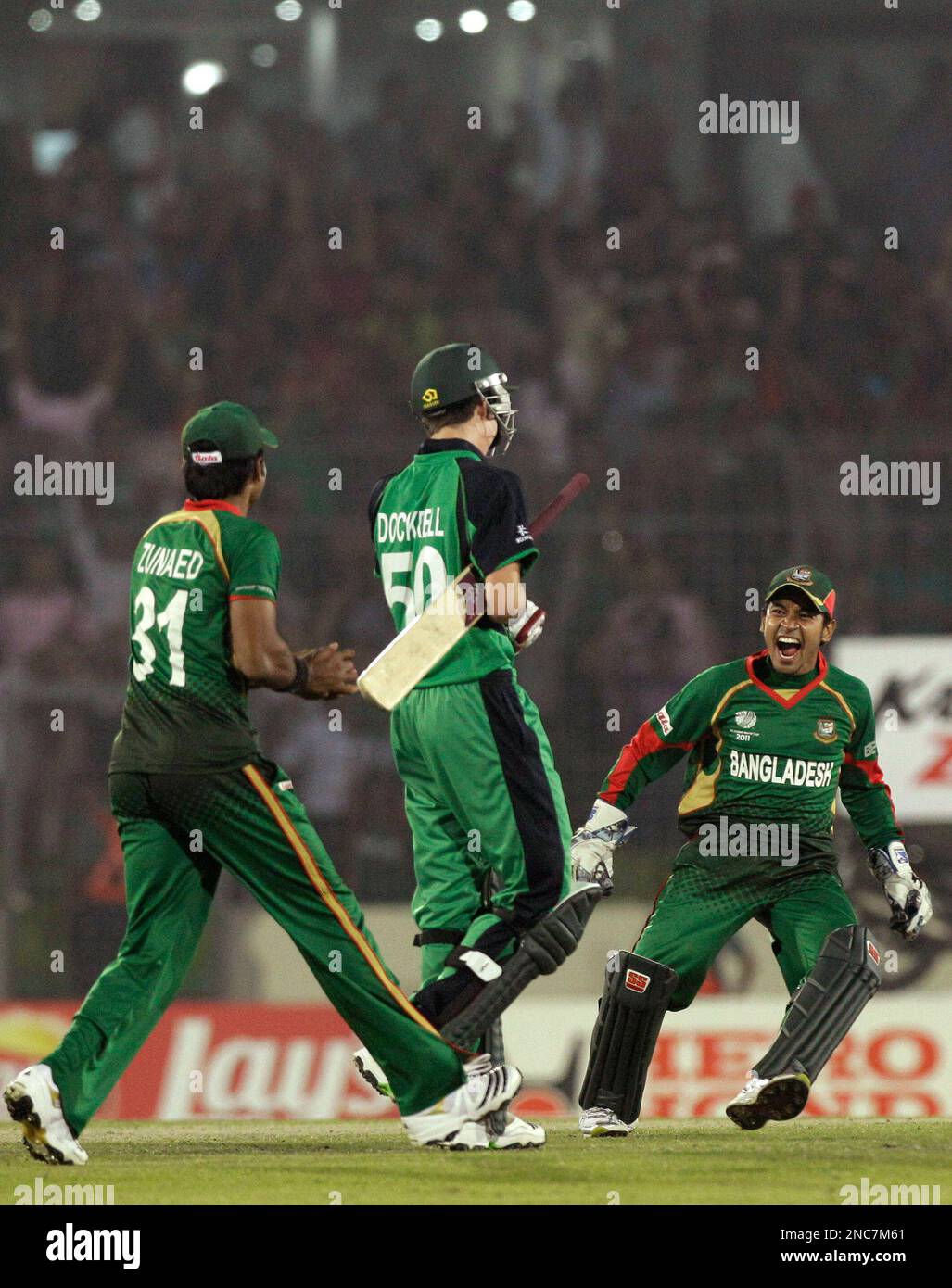 Bangladesh's wicketkeeper Mushfiqur Rahim, right, celebrates after ...