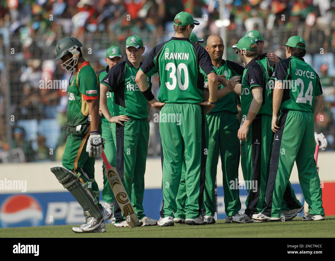 Bangladesh's Tamim Iqbal, left, walks back as Ireland celebrate his ...