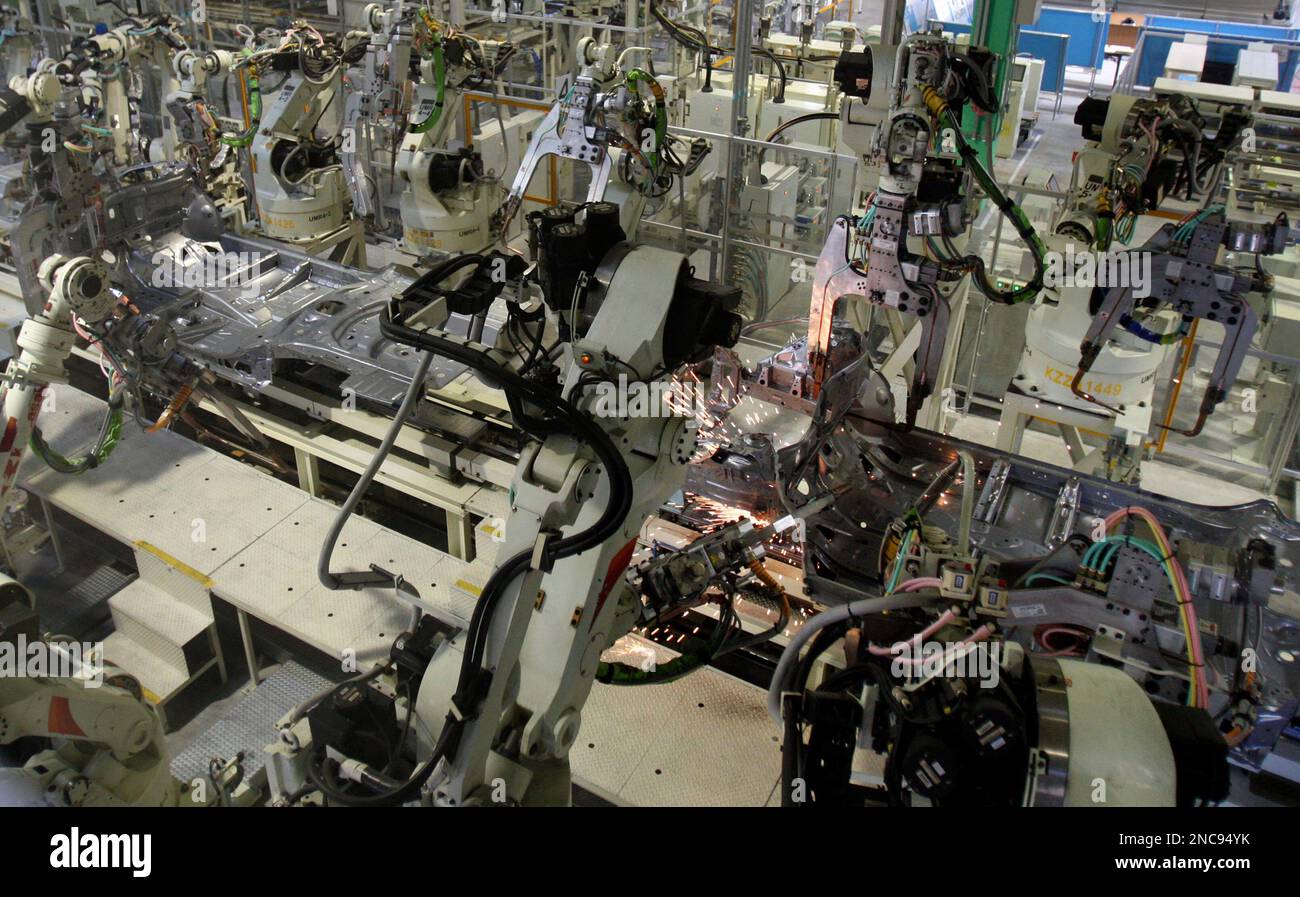 Robots make Yaris compact sedans on a newly opened assembly line at a ...