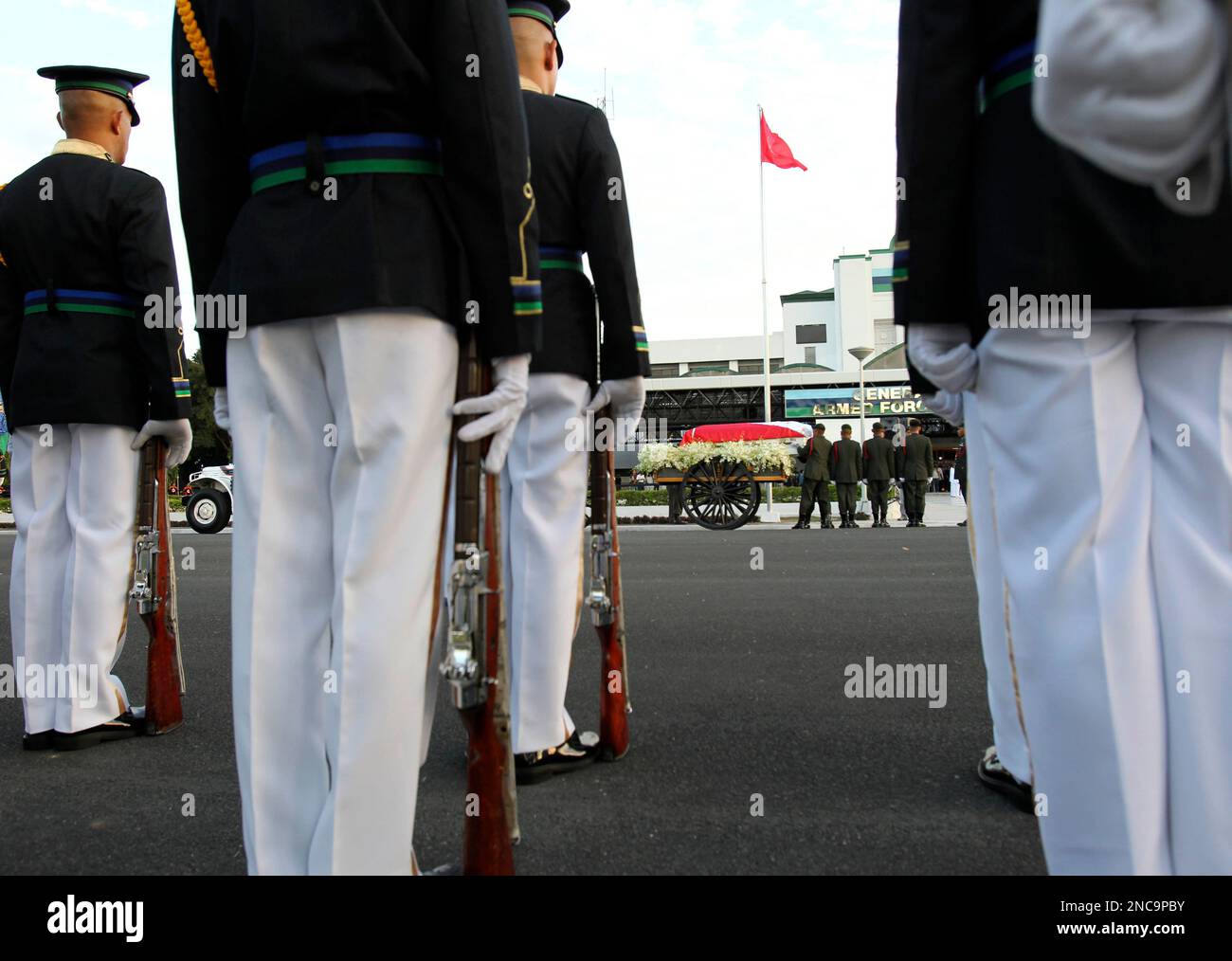 Philippine military pallbearers prepare to transfer the flag-draped ...