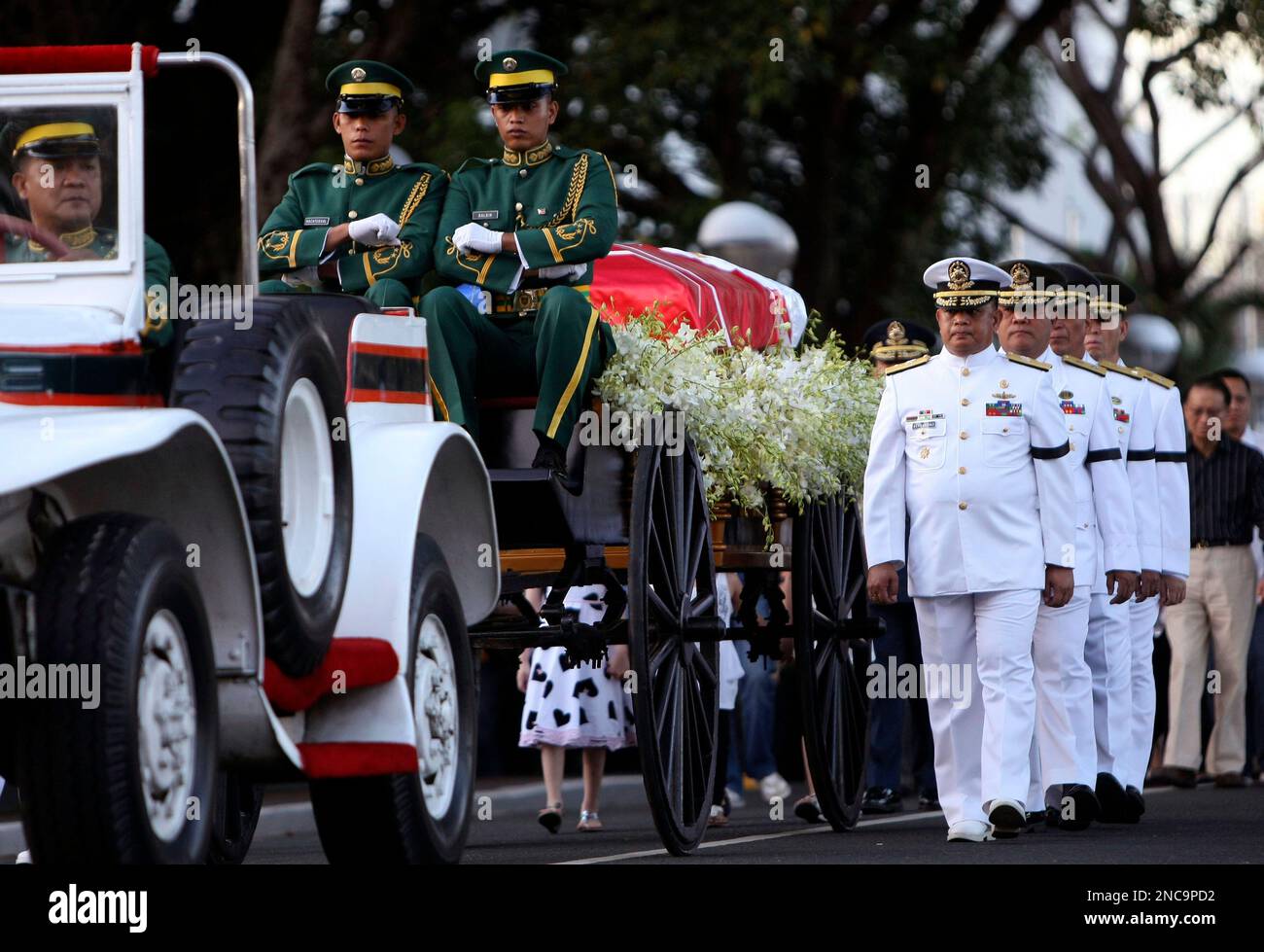 Philippine military generals escort the caisson carrying the flag ...