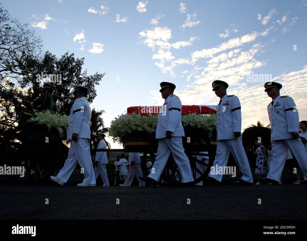 Philippine military generals escort the caisson carrying the flag ...
