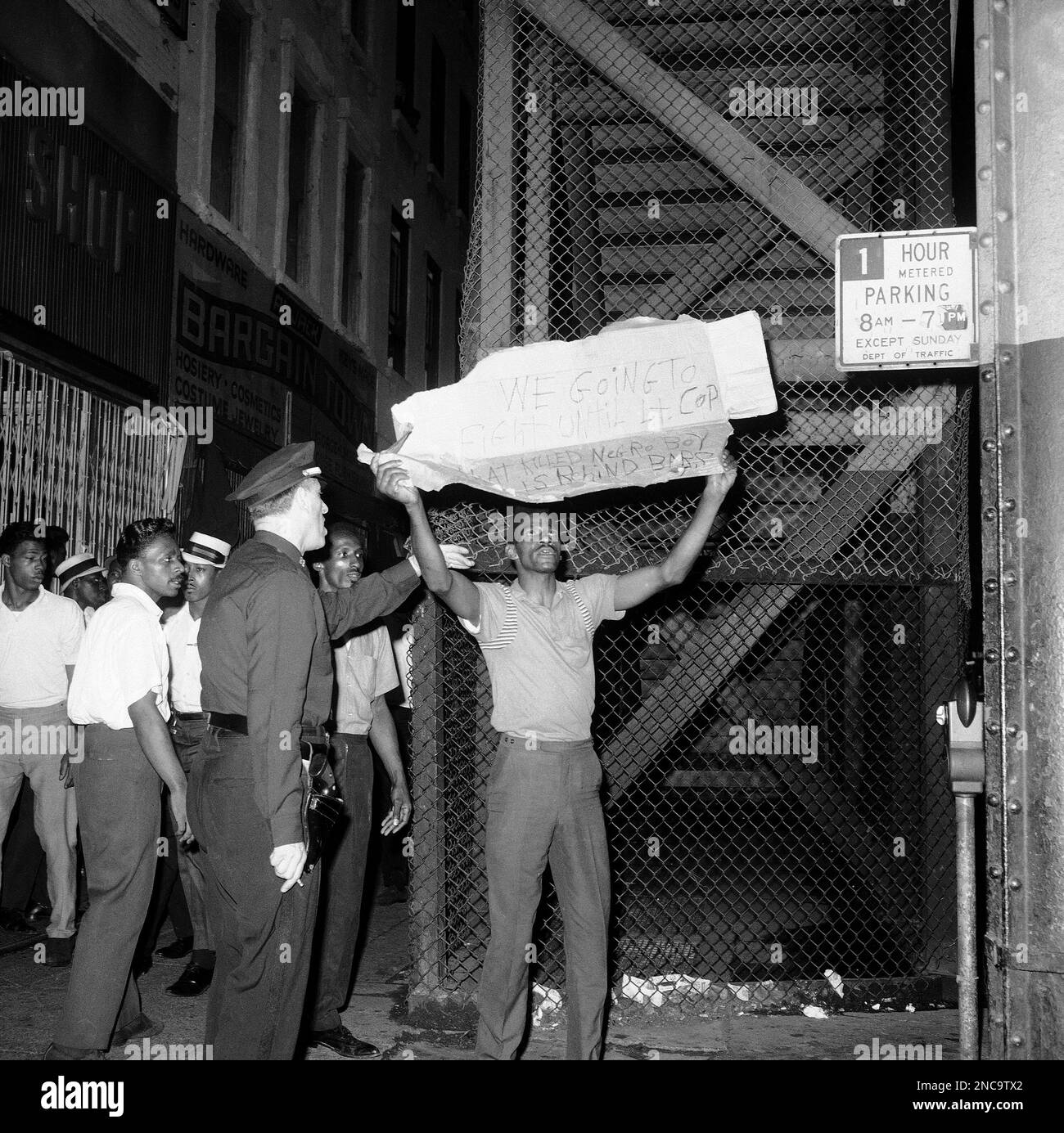Police officer stands by in the Bedford Stuyvesant section of Brooklyn ...