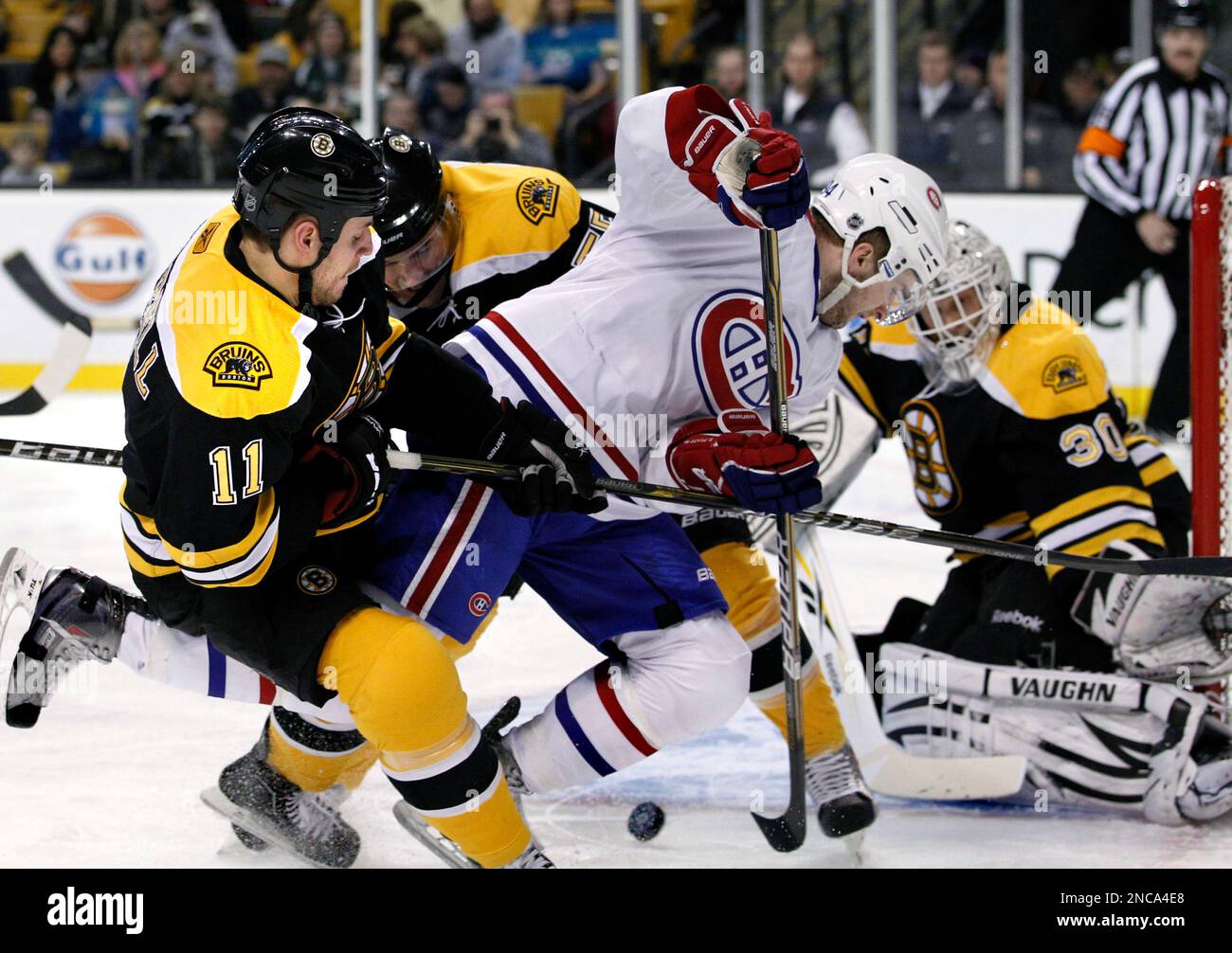 Boston Bruins center Gregory Campbell (11) and defenseman Johnny ...