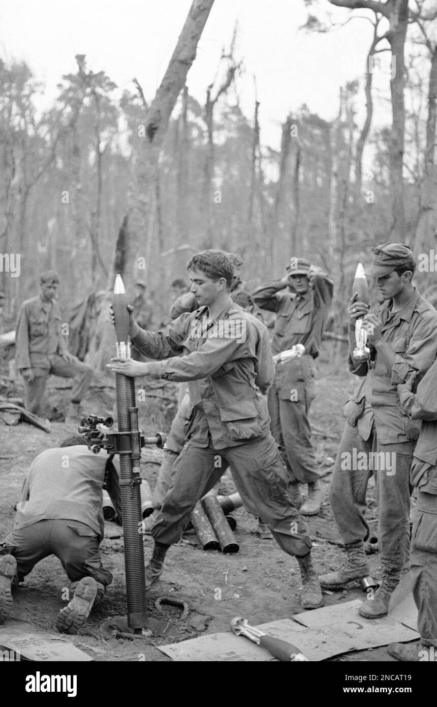 81mm mortar gun crew of the 3rd battalion, 4th marine regt. Fires into ...