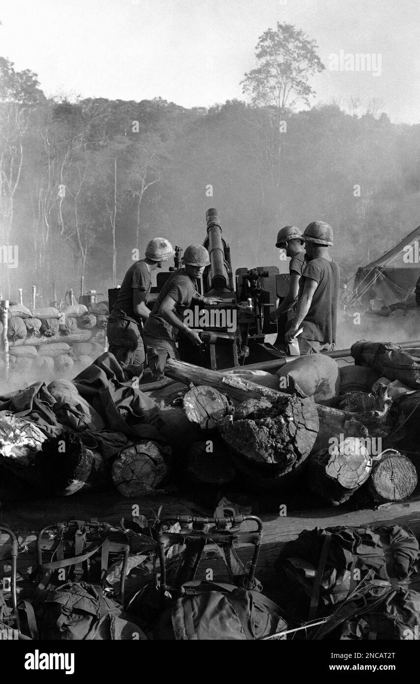 U.S. artillerymen return mortarfire from North Vietnamese gunners with ...