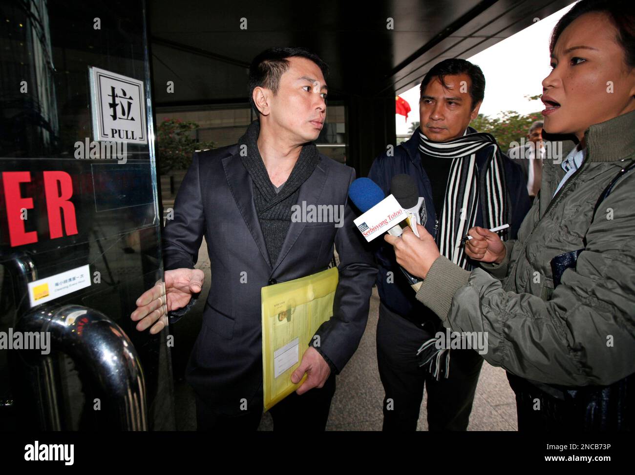 Philippine Rep. Ronald Singson, left, the son of Luis "Chavit" Singson ...