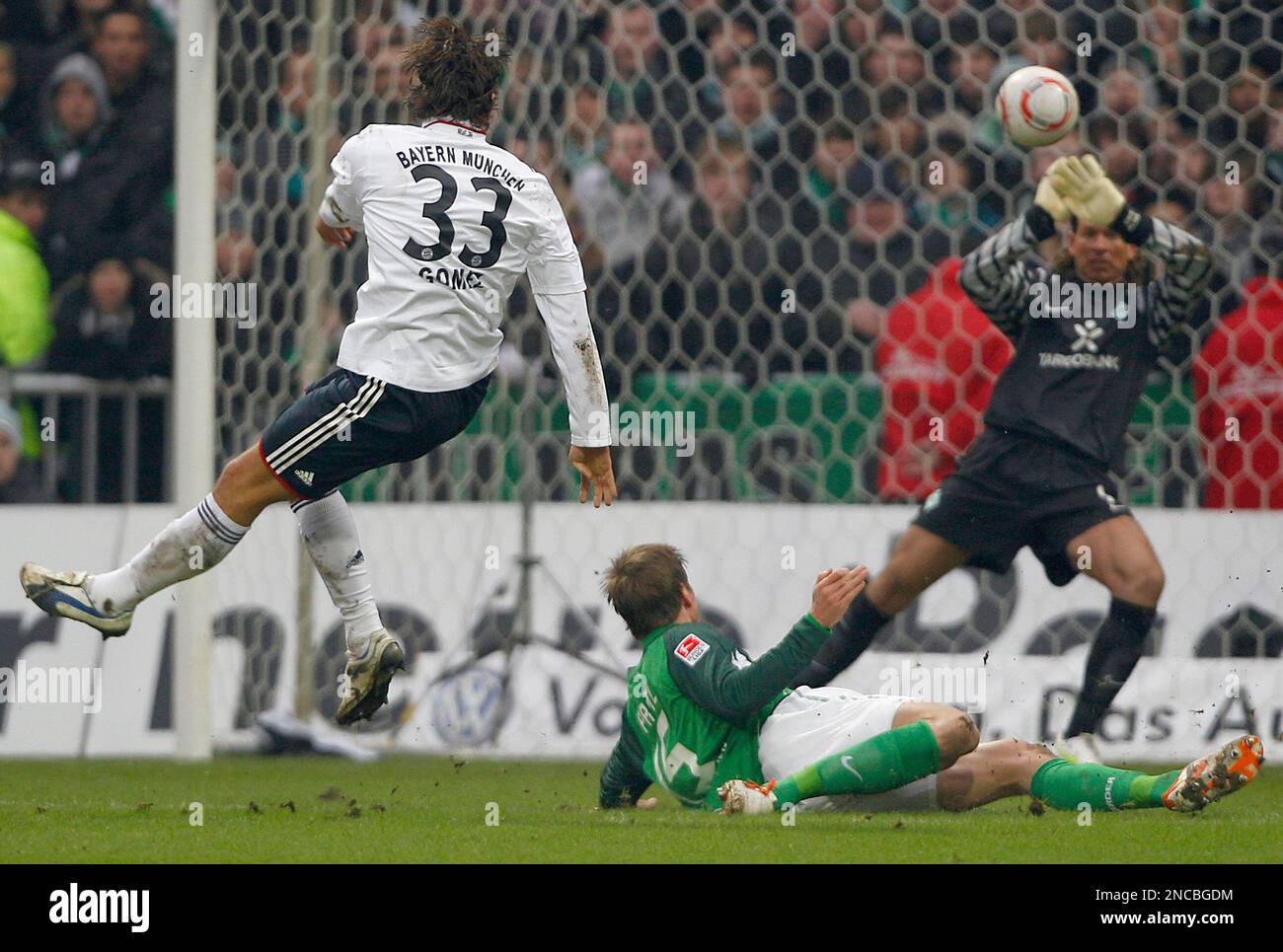Bayern's Mario Gomez, left, and Bremen's Sebastian Proedl, down, of ...