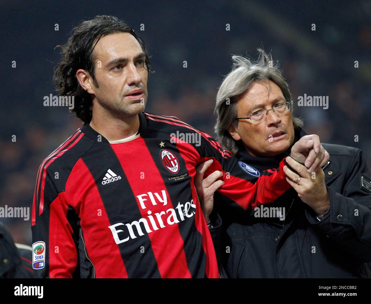 AC Milan defender Alessandro Nesta is helped leaving field of play by ...