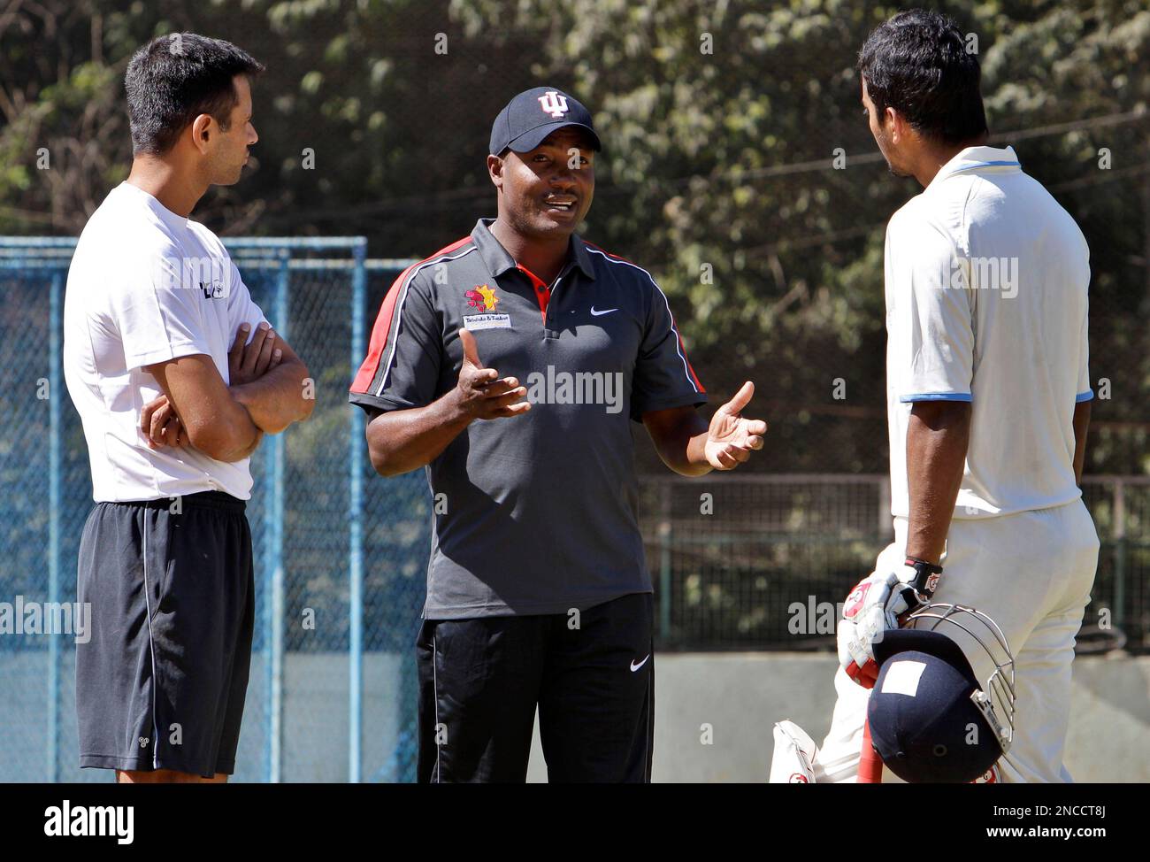 Former West Indies' cricketer Brian Lara, center, speaks to a young ...