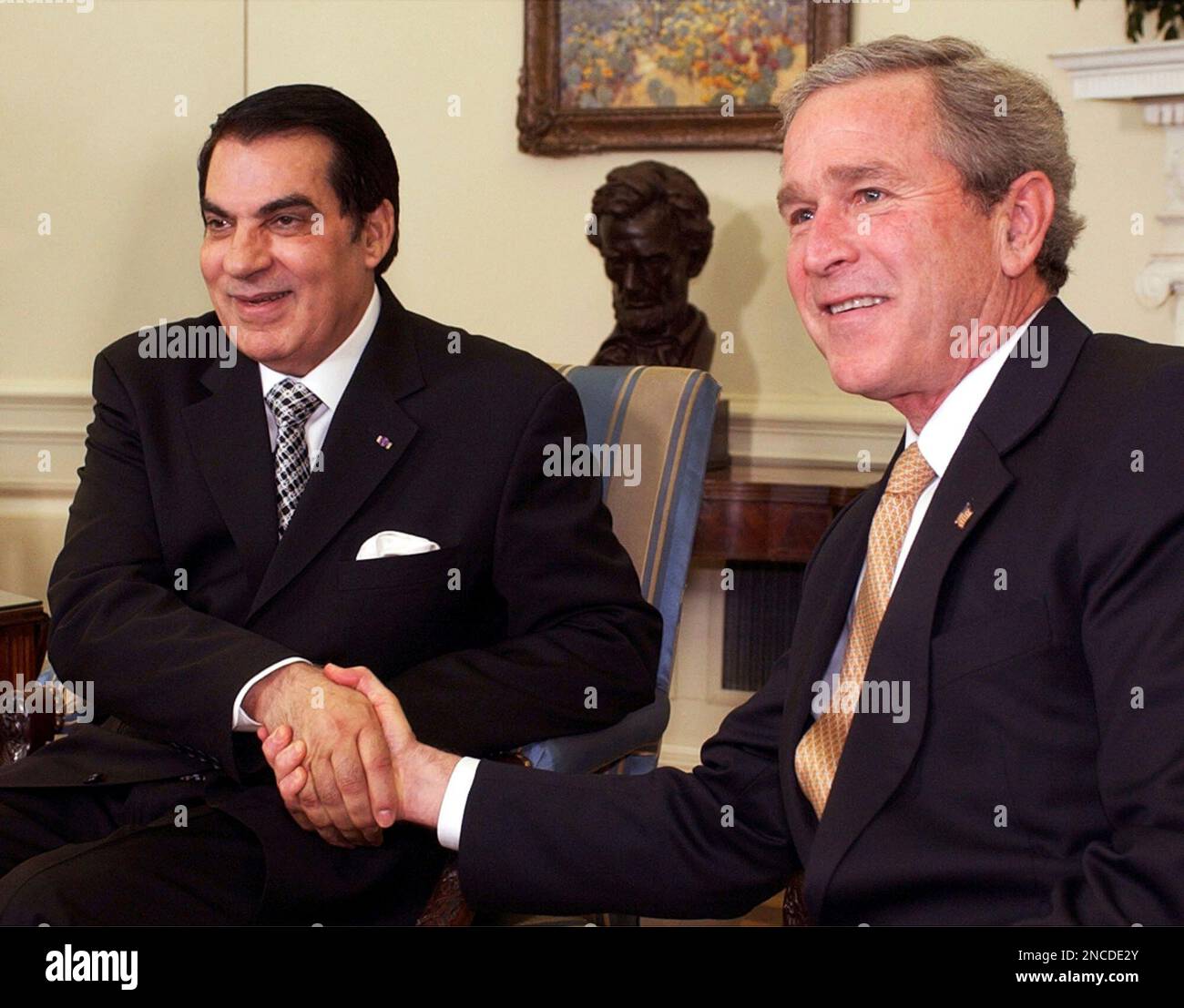 FILE - In this Feb. 18, 2004 file photo, President Bush shakes hands ...