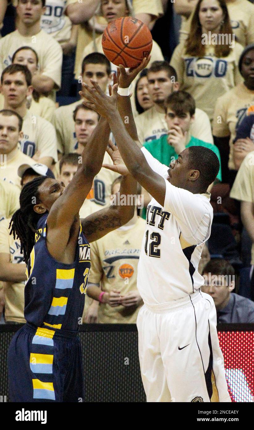 Pittsburgh's Ashton Gibbs (12) shoots over Marquette's Jae Crowder in ...