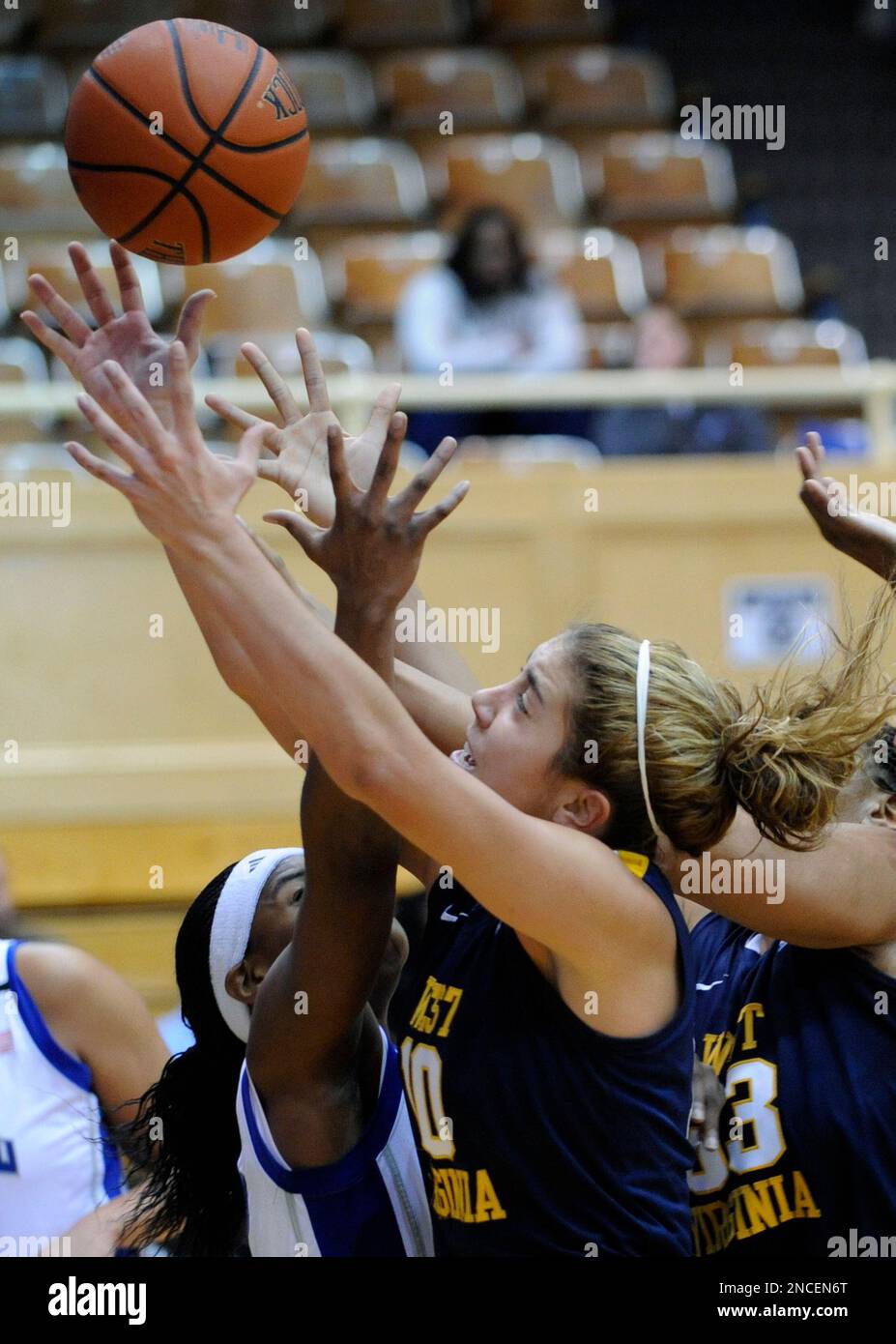 West Virginia's Liz Repella, right, grabs for a loose ball over Seton ...