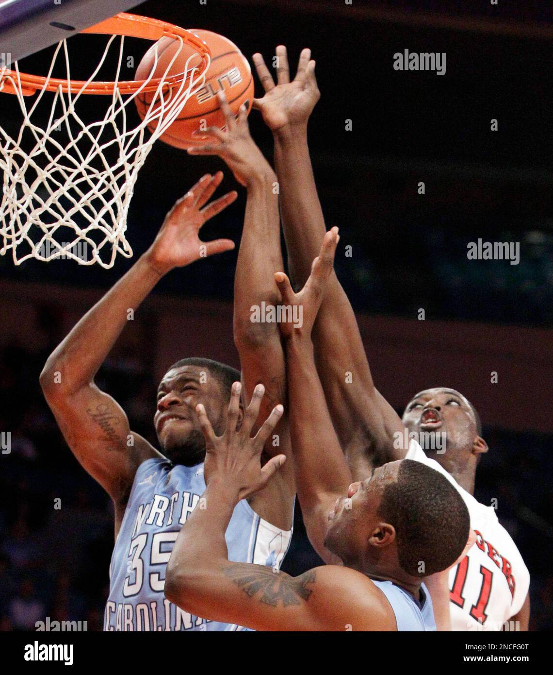 North Carolina guard Reggie Bullock (35) robs Rutgers guard Dane Miller ...