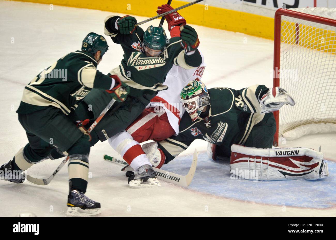 Minnesota Wild goalie Niklas Backstrom, right, of Finland, attempts to ...