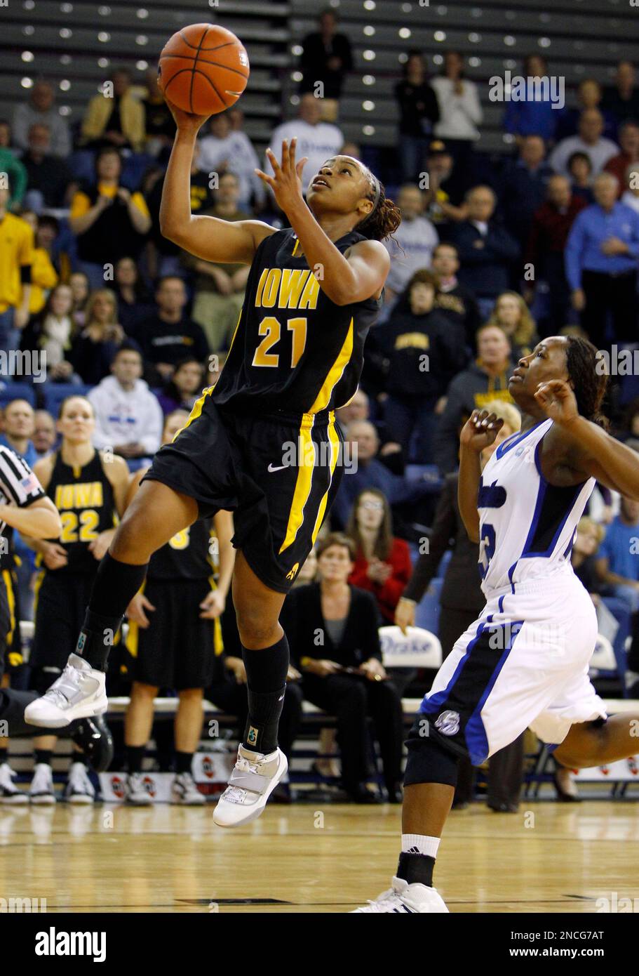 Iowa guard Kachine Alexander, left, drives to the basket past Drake ...