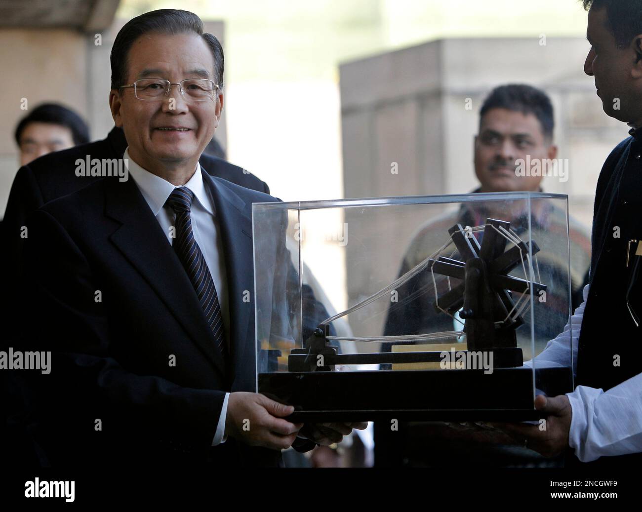 Chinese Premier Wen Jiabao, left, receives a memento at the memorial of Mahatma Gandhi in New ...