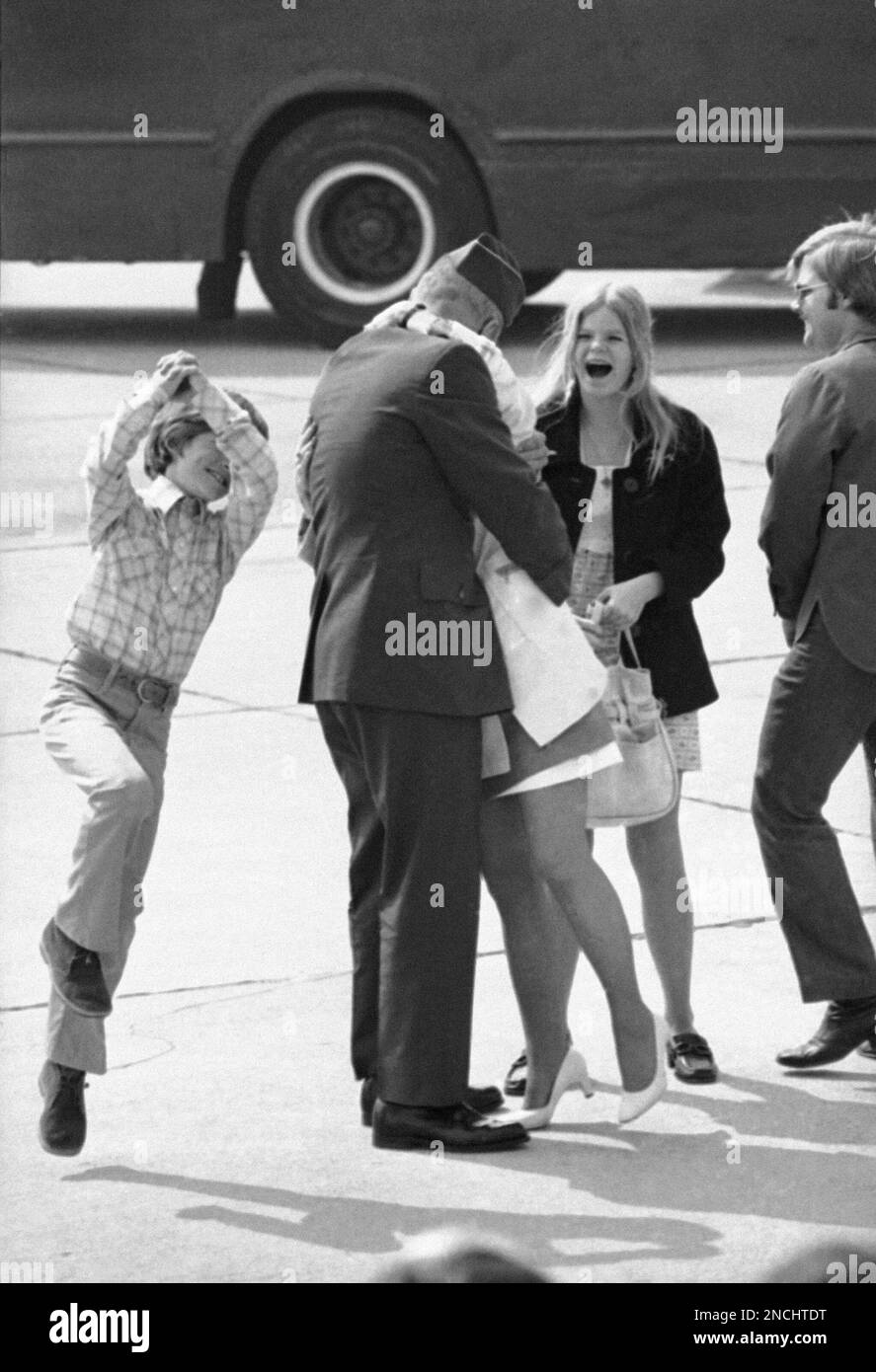 Lyndall Gutterson, 9, jumps for joy as his father, Col. Laird Gutterson ...