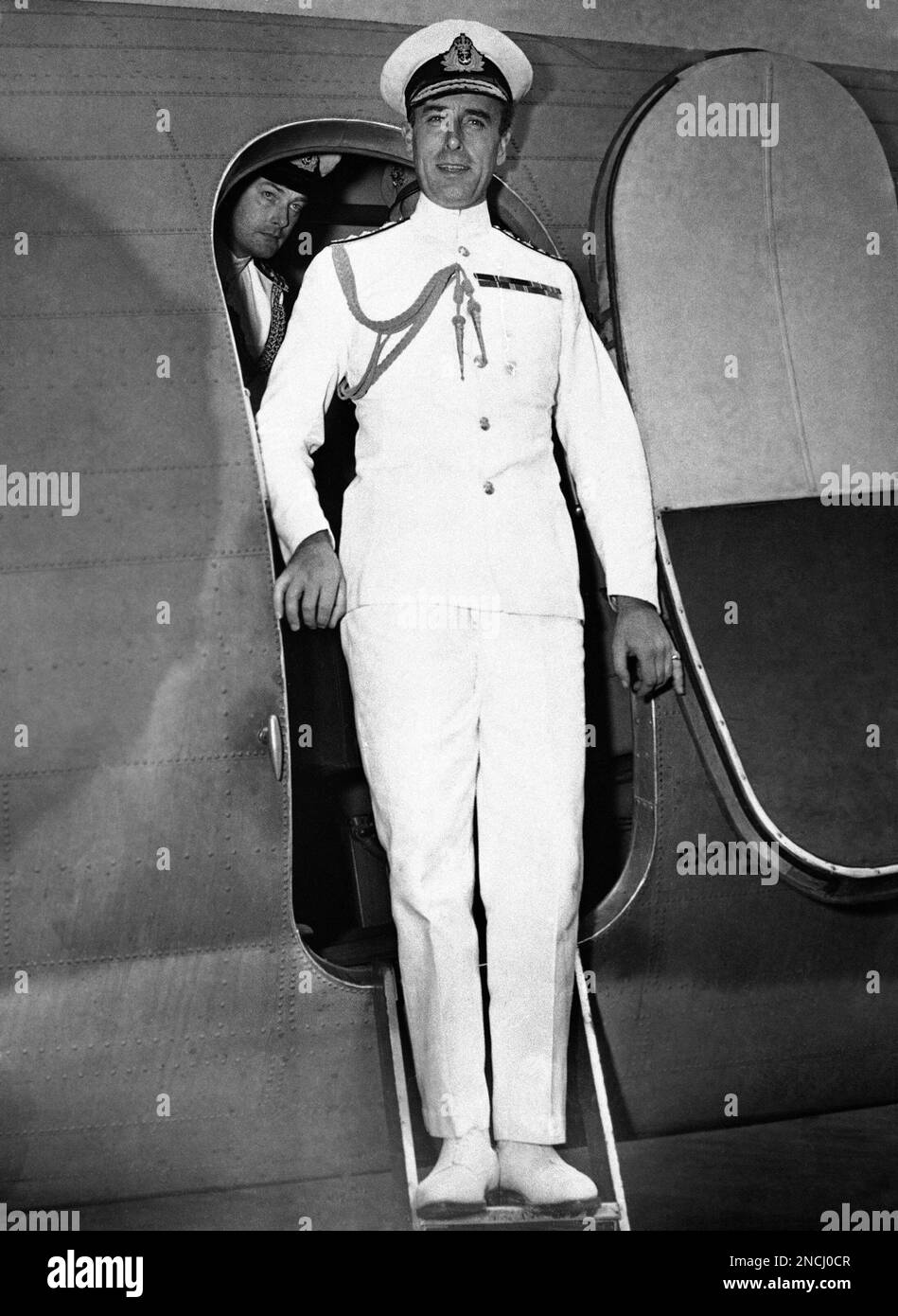 Wearing immaculate dress whites, Vice Admiral Lord Louis Mountbatten ...