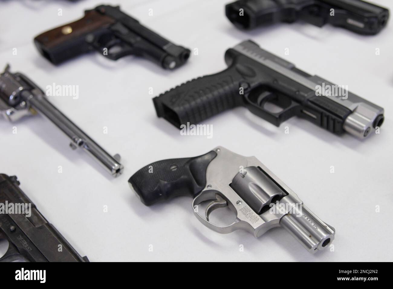 Guns that were purchased by undercover police officers are displayed ...