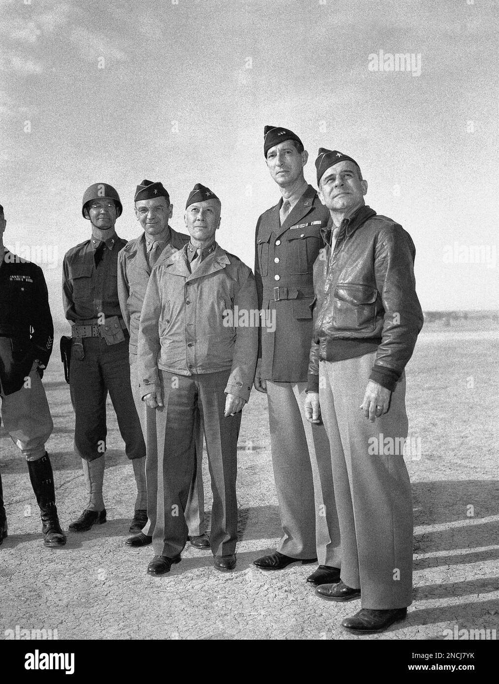 Watching the arrival of allied planes at a North African airfield are ...