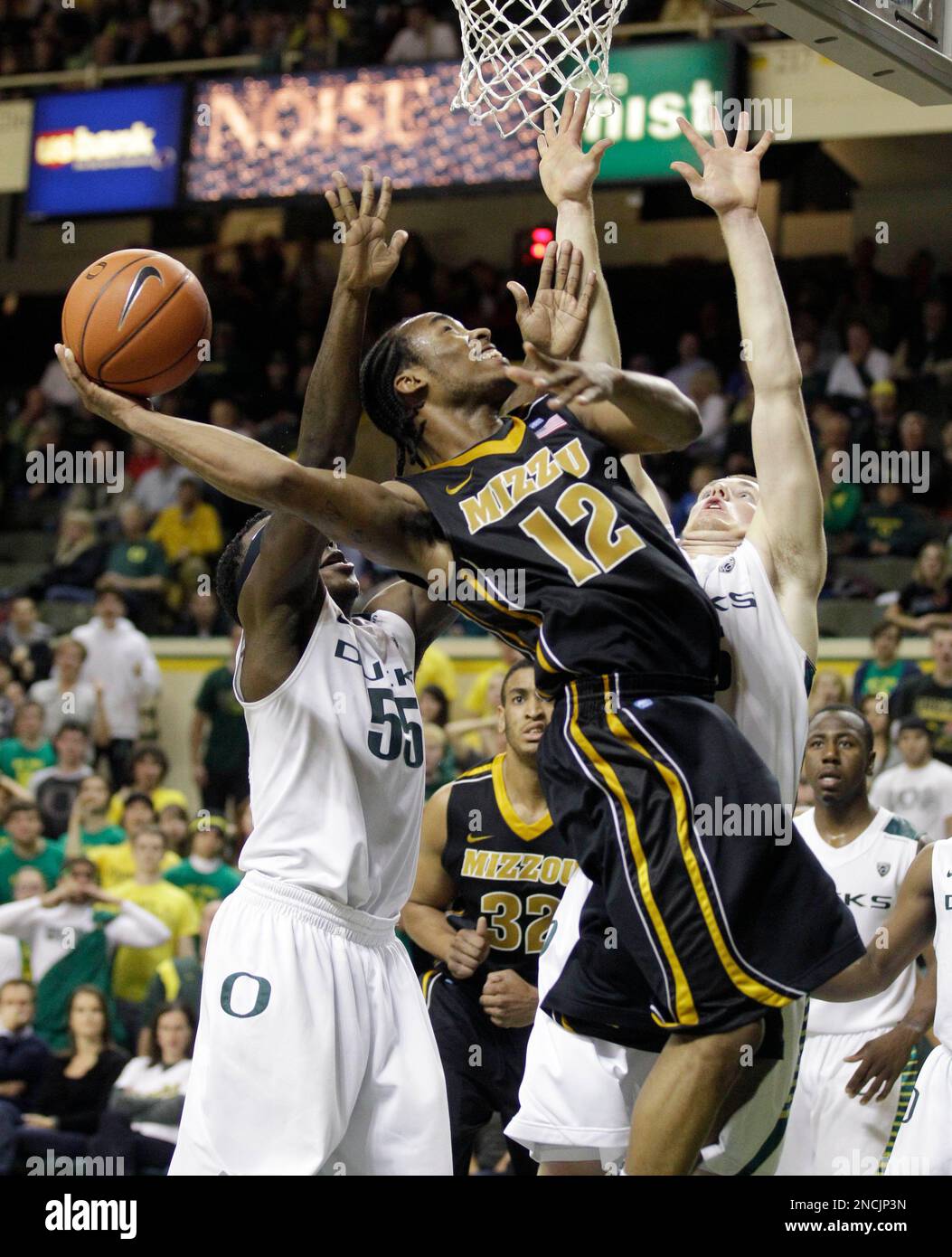 Missouri guard Marcus Denmon (12) drivesto the basket as Oregon's Jay-R ...