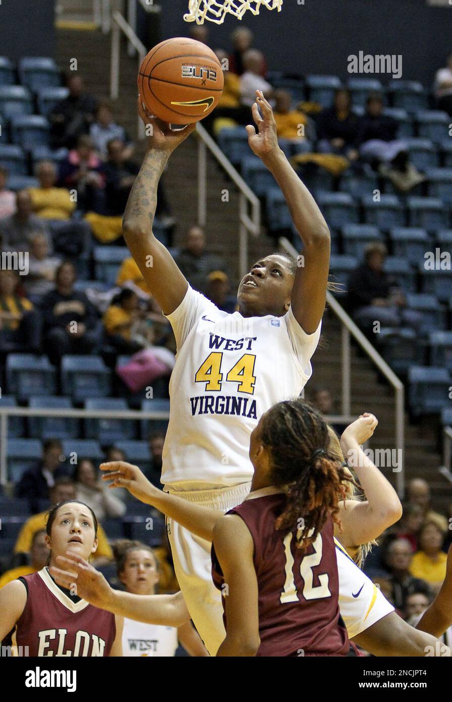 West Virginia's Madina Ali (44) shoots over Elon's Tiara Gause (12) in ...