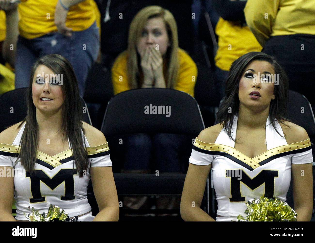 Missouri dance team members watch the final moments of their overtime ...