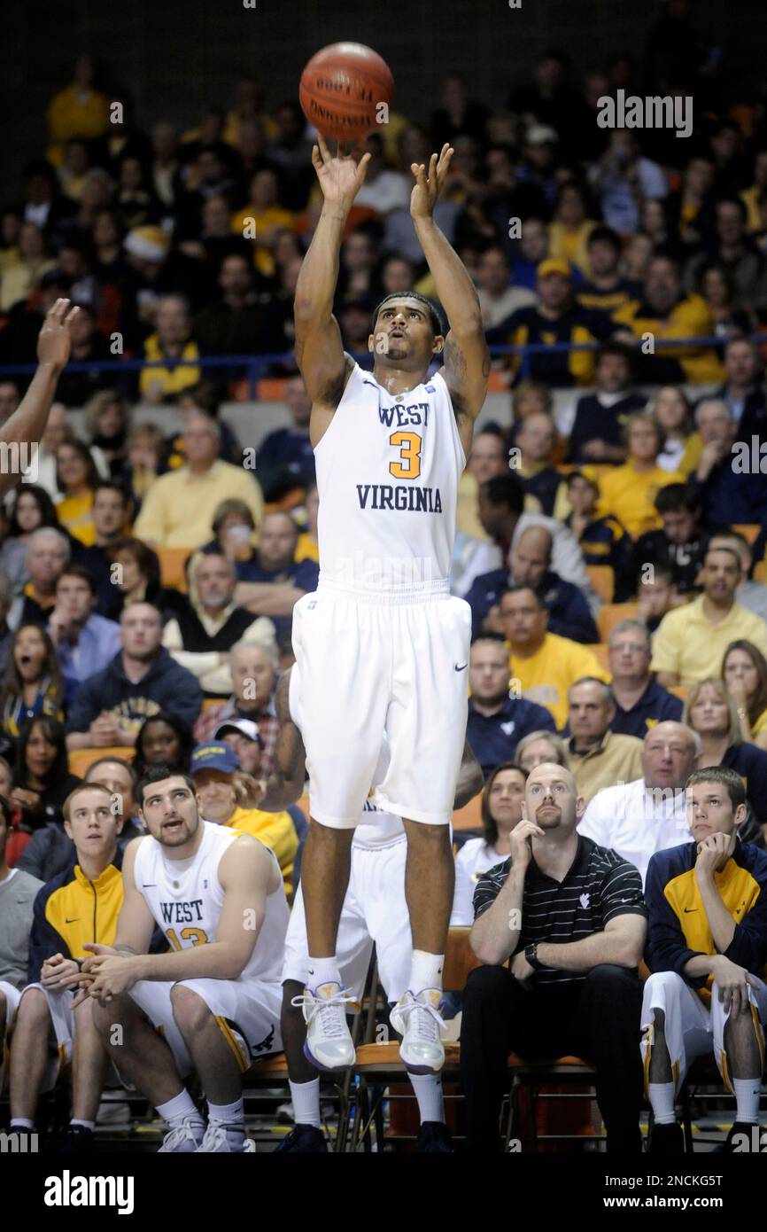 West Virginia's Casey Mitchell shoots against VMI during the second ...