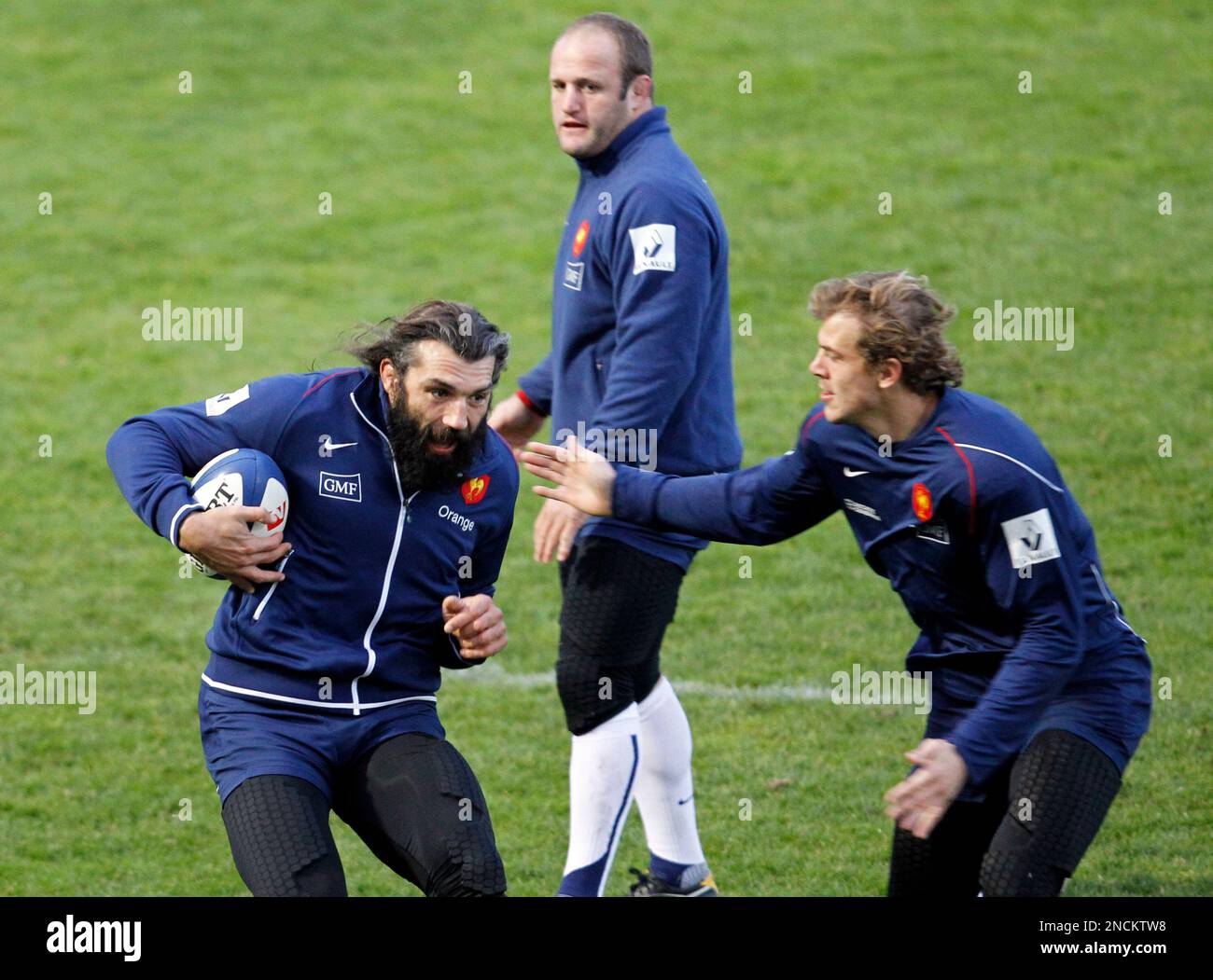 France's rugby team players Sebastien Chabal, left, runs as Aurelien ...