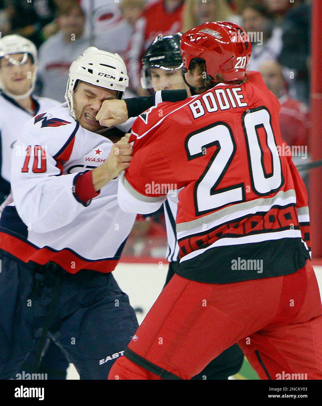 Carolina Hurricanes' Troy Bodie (20) punches Washington Capitals' Matt Bradley (10) in the face ...